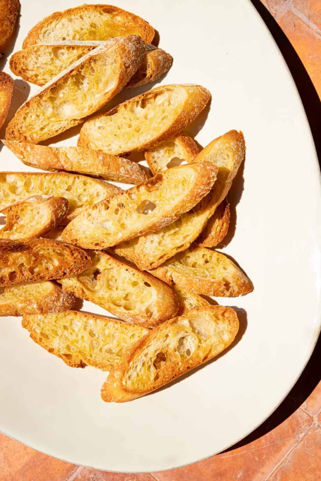 Easy Garlic Crostini Recipe (Perfect for Bruschetta) - Seasoned and Salted