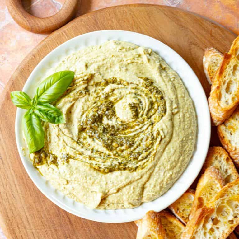 Easy Basil Pesto Hummus Recipe (Homemade Creamy Dip) - Seasoned and Salted