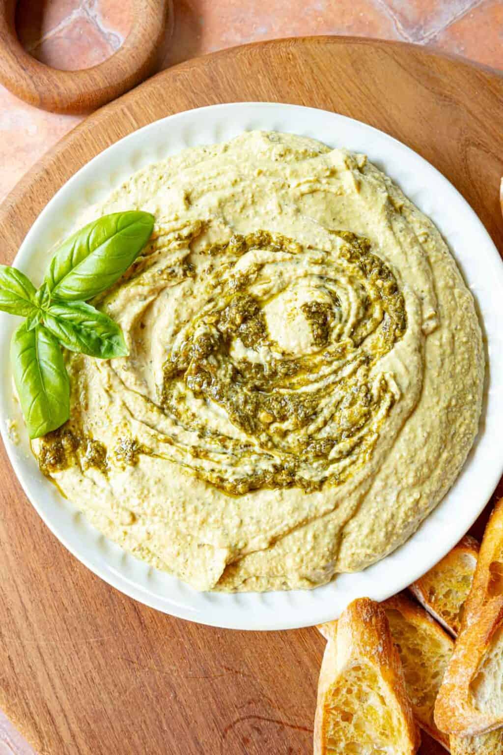 Easy Basil Pesto Hummus Recipe (Homemade Creamy Dip) - Seasoned and Salted