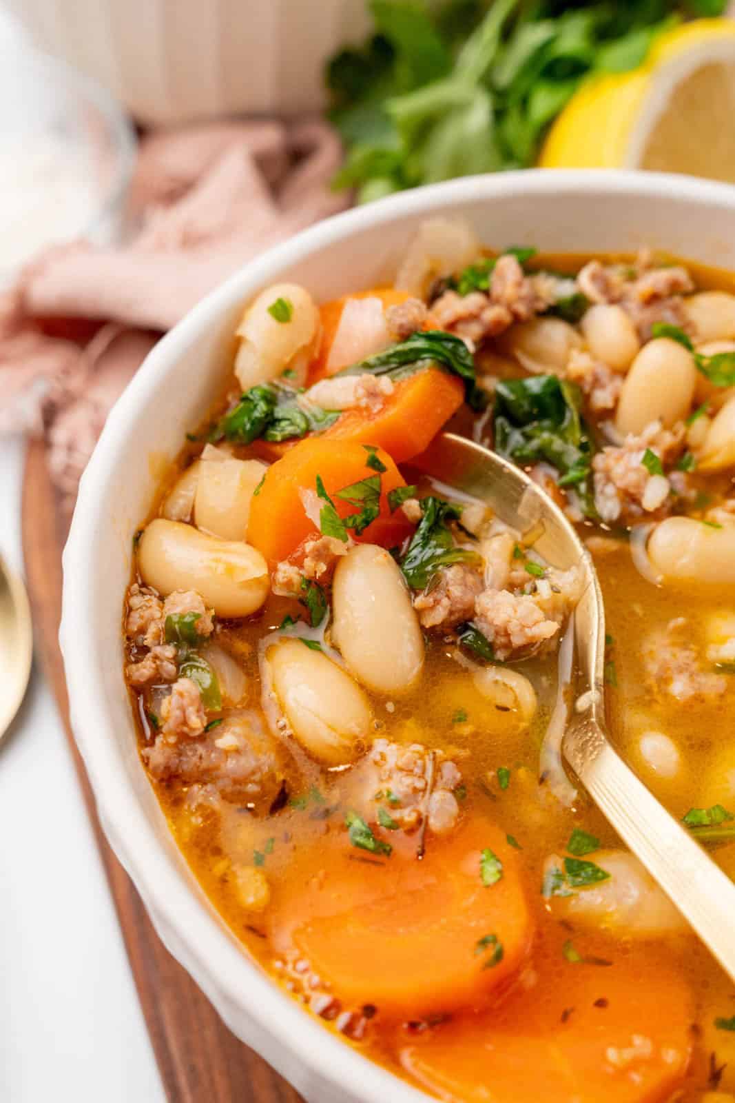Italian Sausage and White Bean Soup Recipe with Kale - Seasoned and Salted